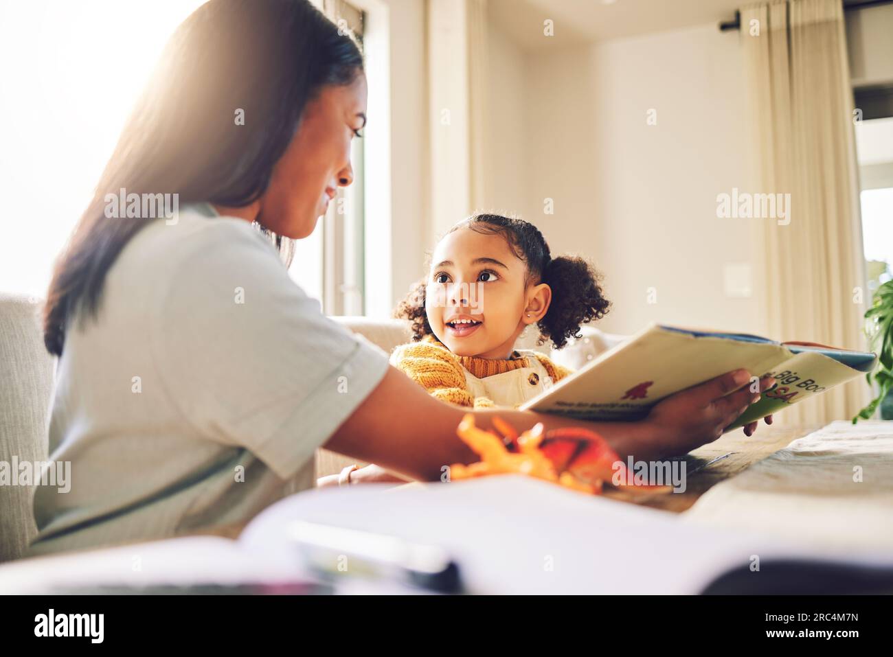 Happy, help and a mother with a child for reading, teaching and support ...