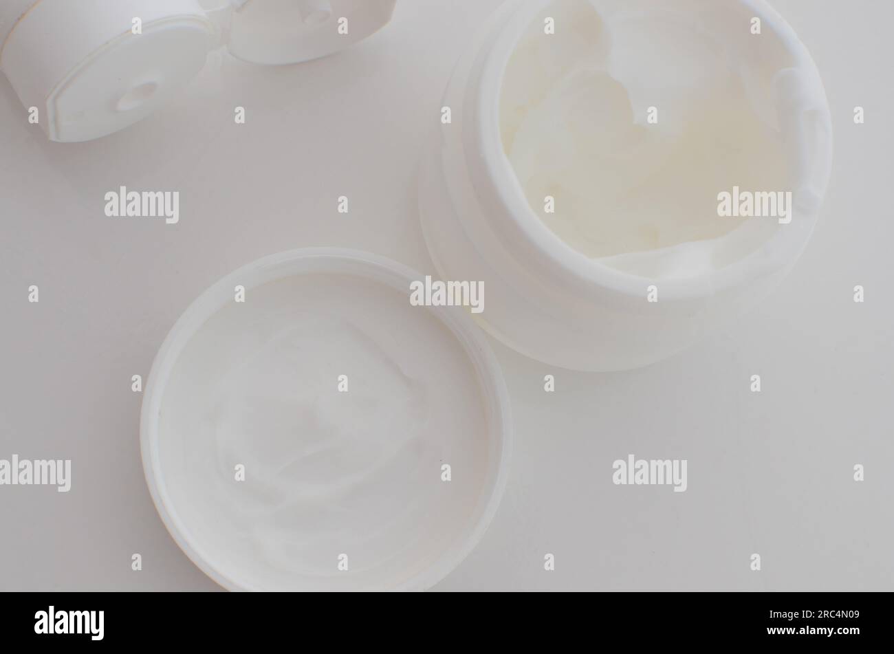 Concept of beauty and well-being through white cream in a delicate ...