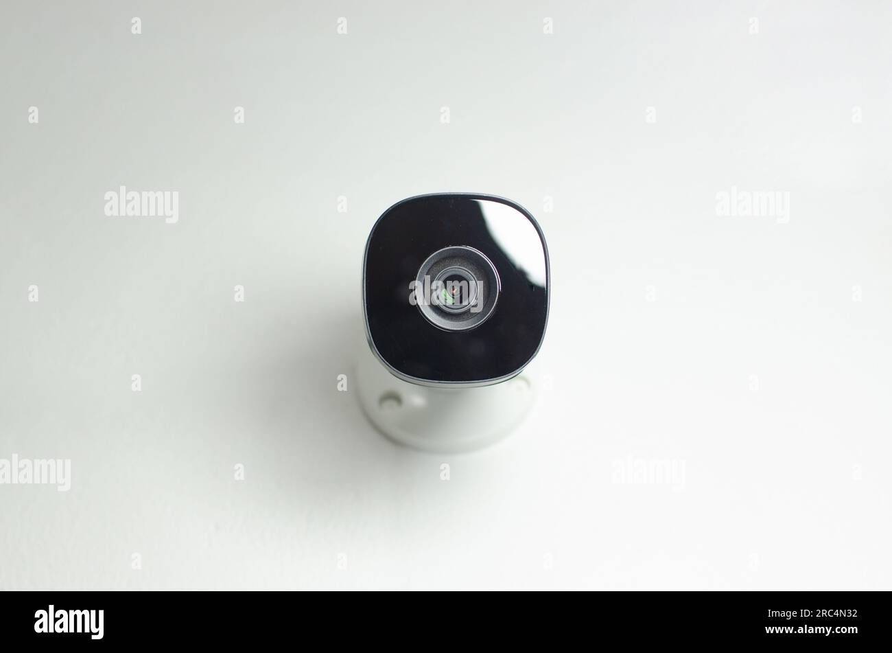 White security camera watchful eye, ensuring the surveillance and ...