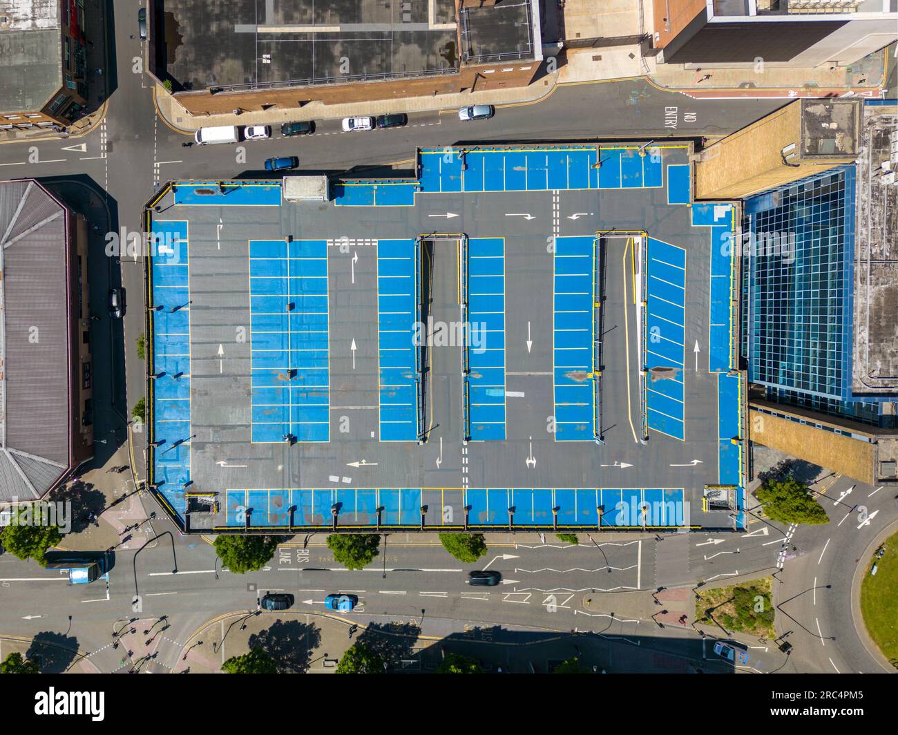 This drone photo from above shows a parking garage in the city centre ...