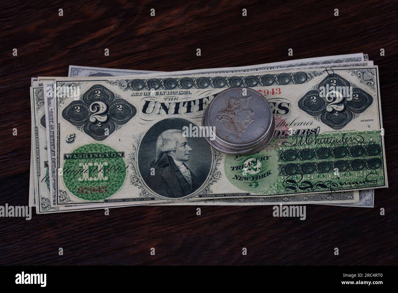 Old west US banknotes and silver certificates with silver dollar coins ...