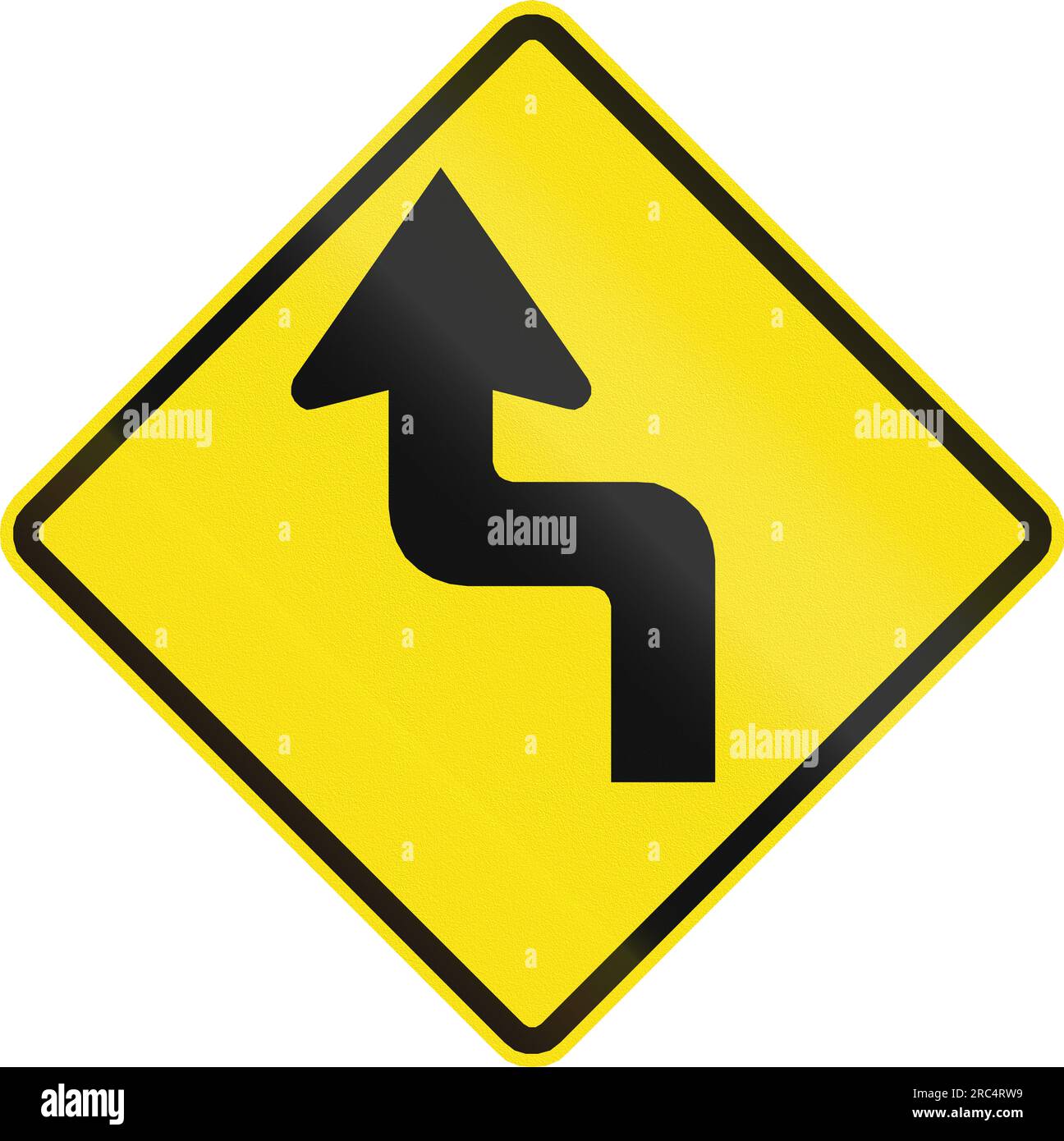 Chilean road warning sign: Reverse curve first to left Stock Photo - Alamy