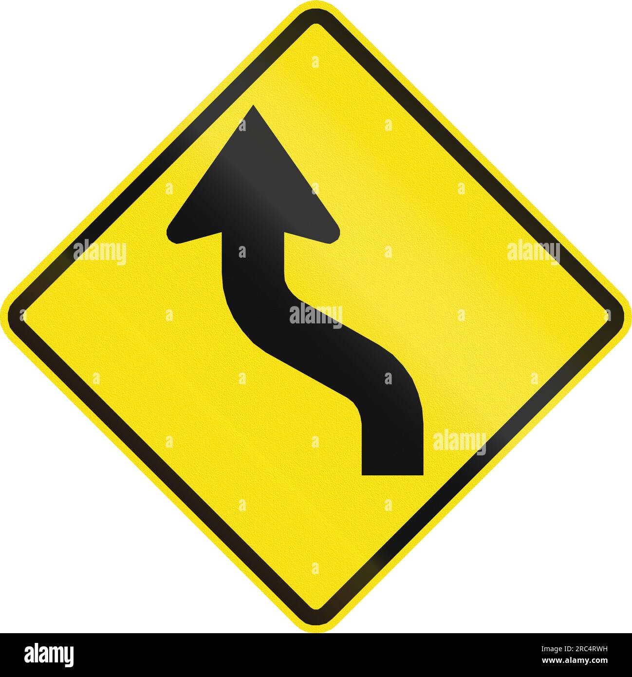 Chilean road warning sign: Reverse curve first to left Stock Photo - Alamy