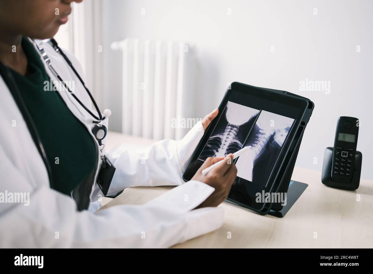 Side view of crop African American female doctor in uniform and ...