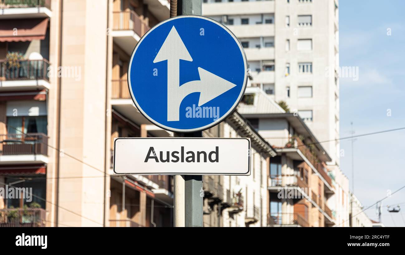 Image shows a signpost and a sign in the direction of foreign countries ...