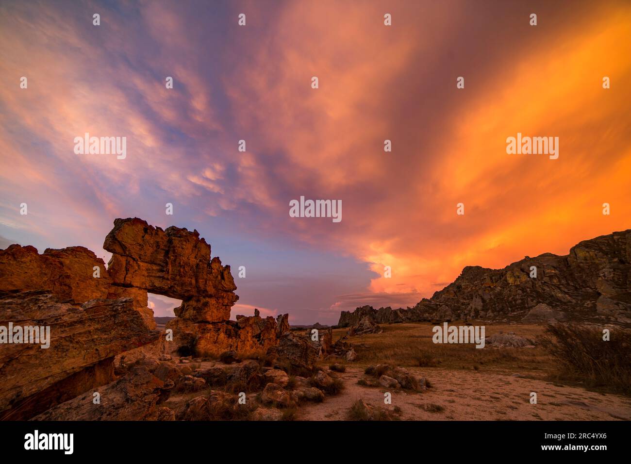 Stunning view of rocky formations with window on highland against ...