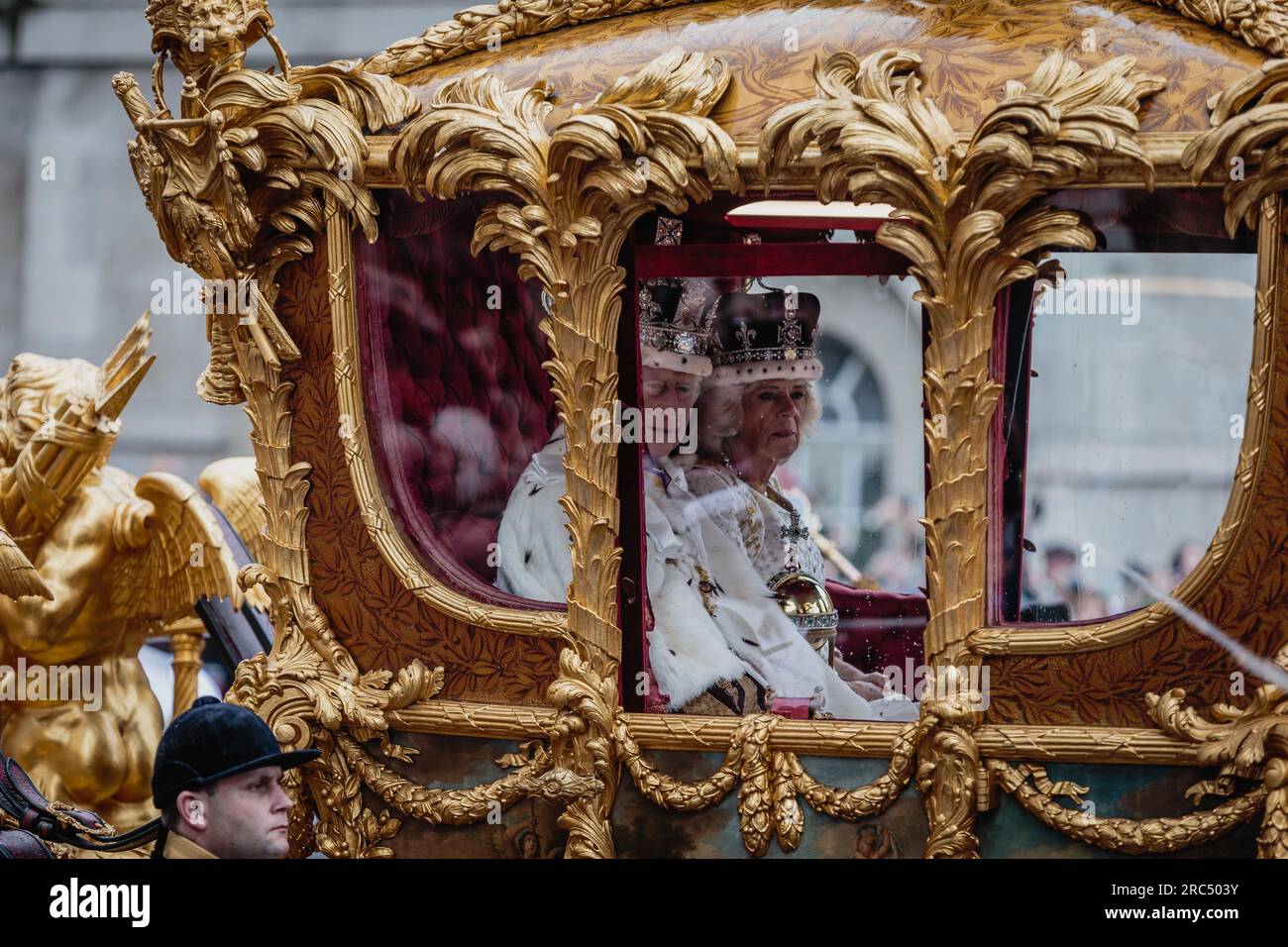 King Charles and Queen Camilla smile as they make their way back to ...