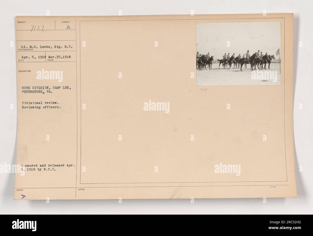 The image shows reviewing officers during a divisional review in Camp ...