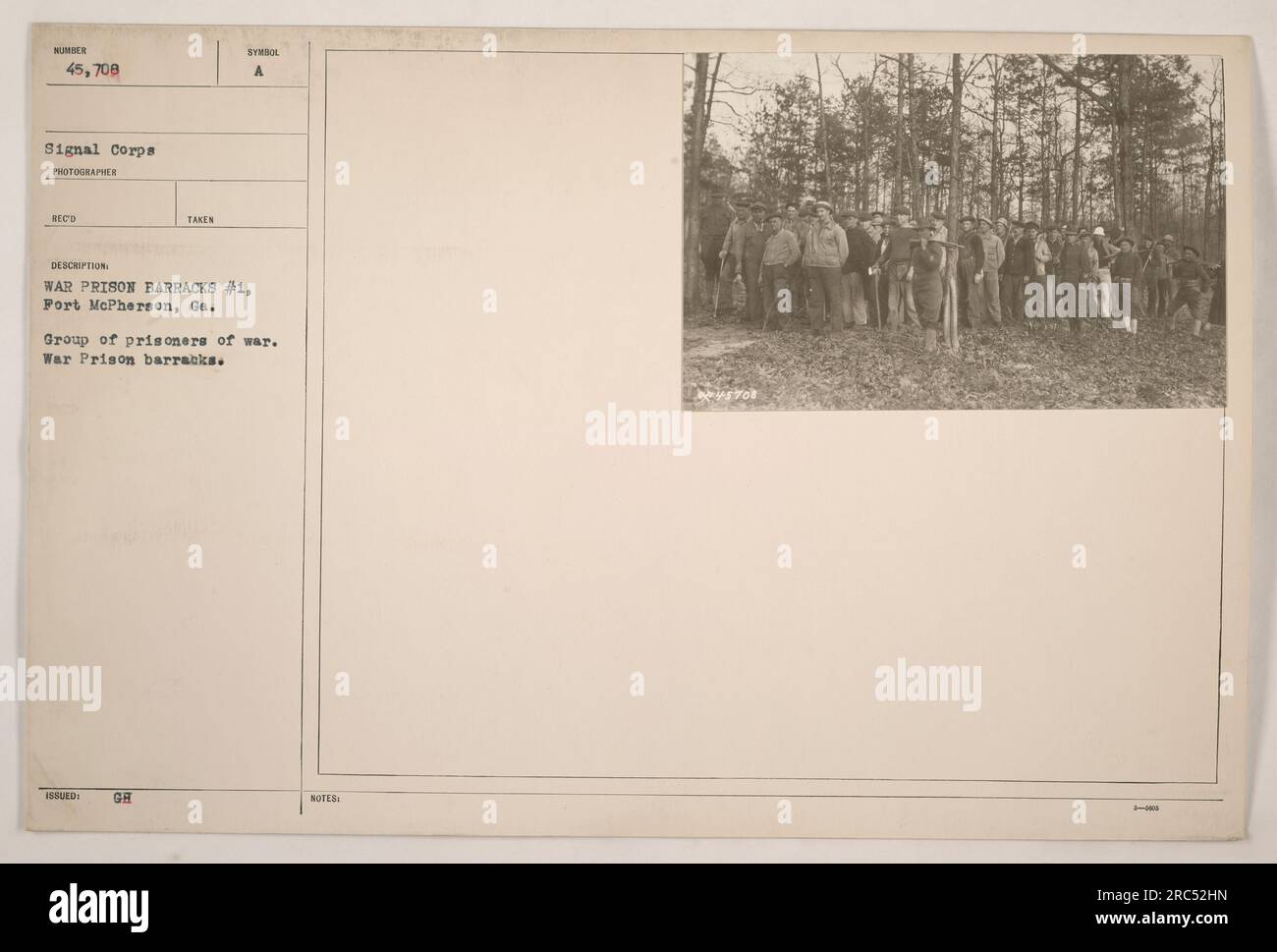 Group of prisoners of war standing outside War Prison Barracks #1 at ...