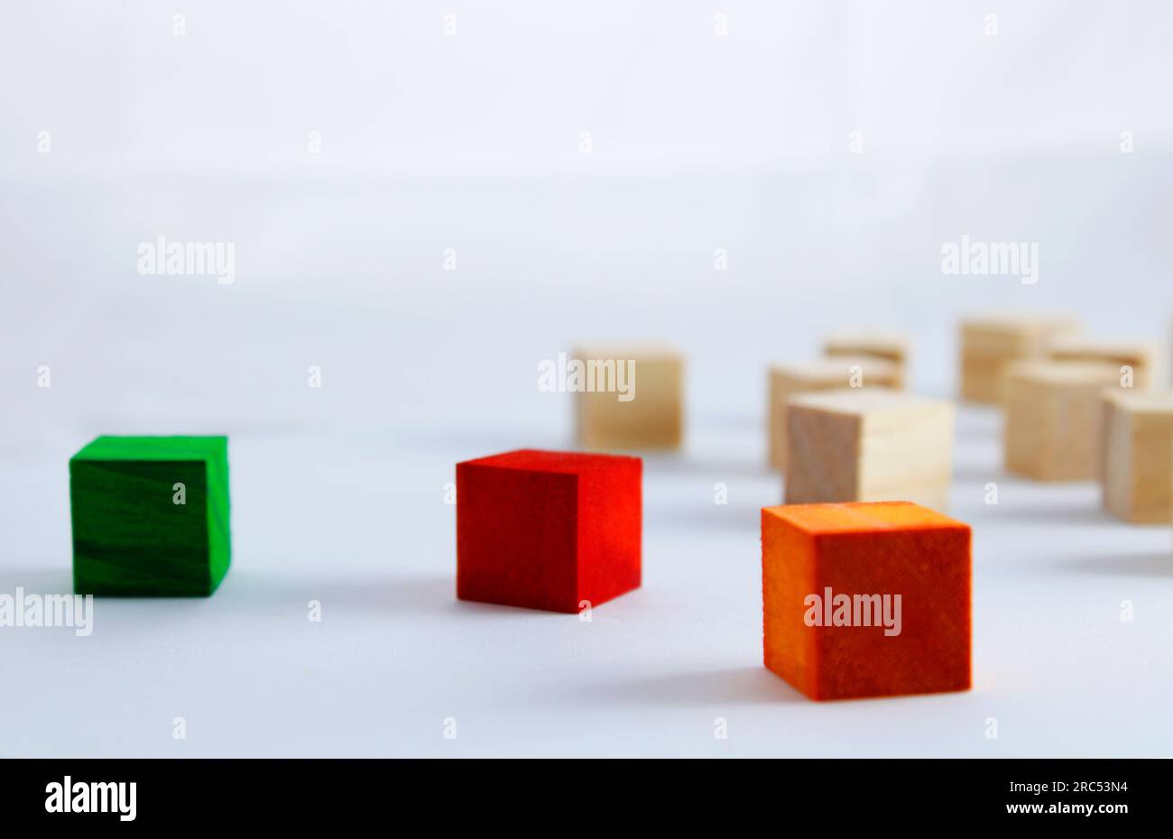Group of wooden cubes where three are of different colors Stock Photo ...