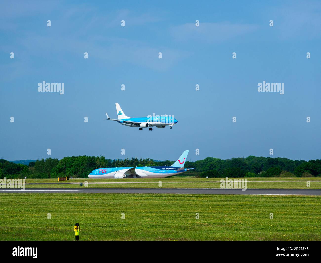 Manchester UK June 2023 KLM flight landing above a TUI plane at ...