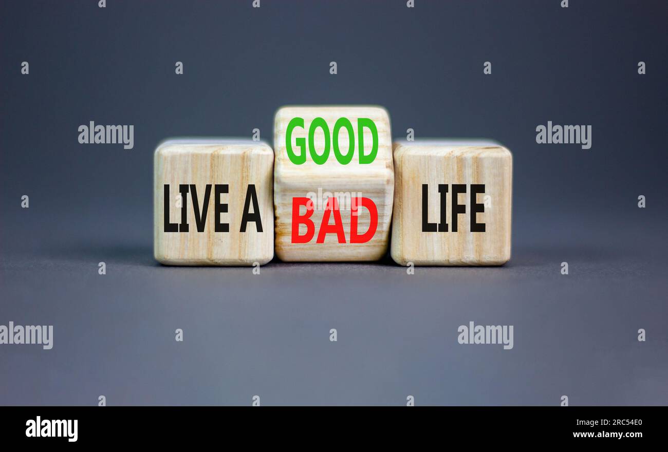 Live good life symbol. Concept word Live a good or bad life on wooden ...
