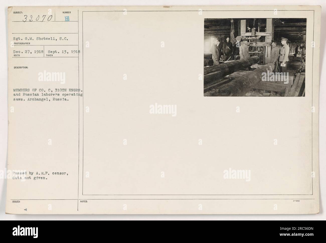 Members of Co. C, 310th Engineers, alongside Russian laborers, using ...