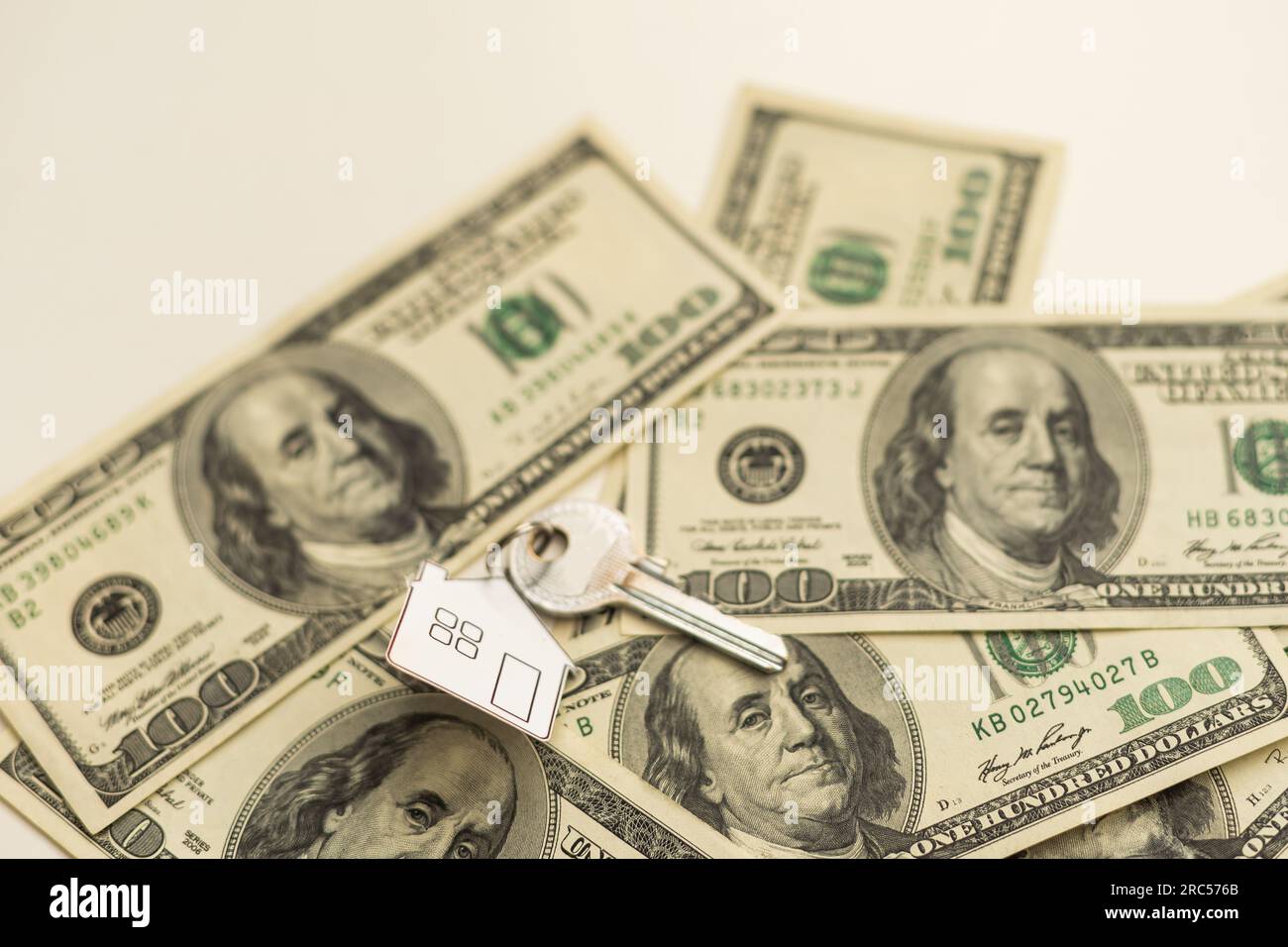 Money and key - safety and home expense concept Stock Photo - Alamy