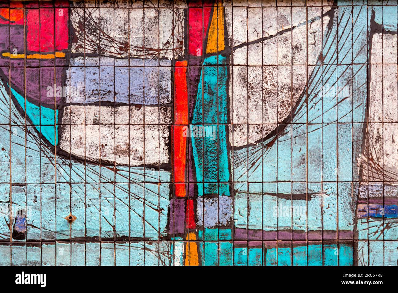 Detail from a building exterior covered with glazed ceramic tiles with ...