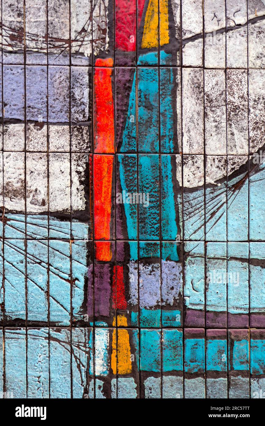 Detail from a building exterior covered with glazed ceramic tiles with ...