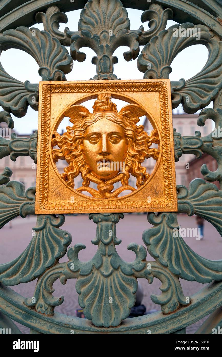 Gold colored bas relief decoration on metal fences Stock Photo - Alamy
