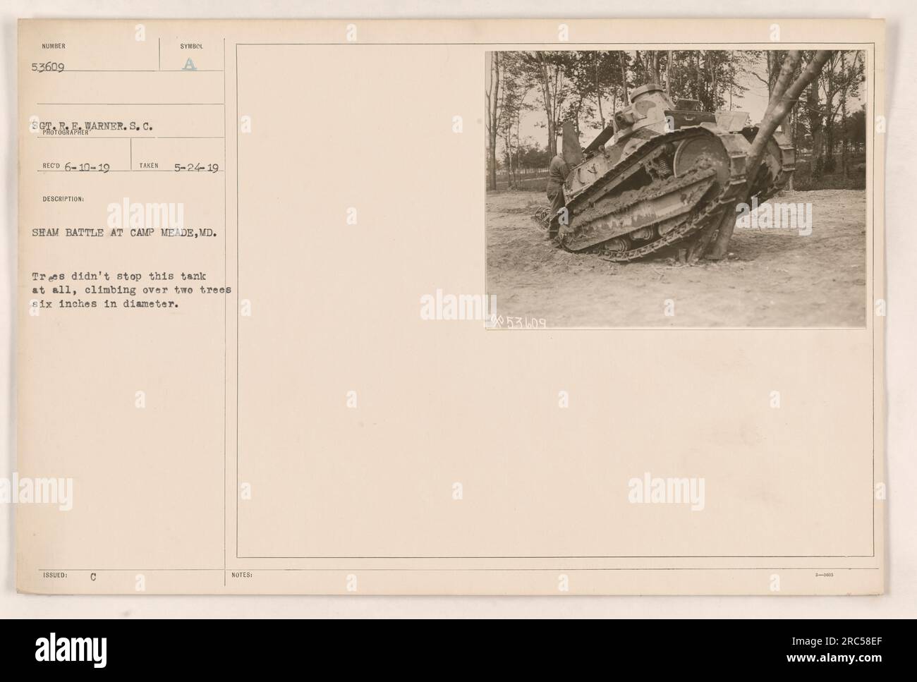 Tank climbing over trees during a sham battle at Camp Meade, Maryland ...