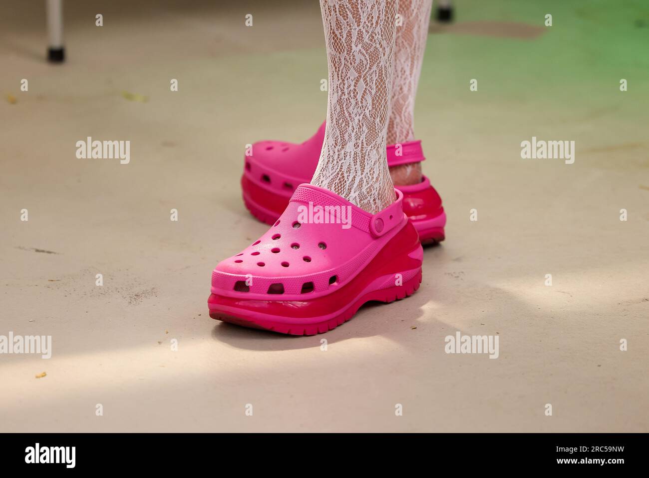 Berlin, Germany. 12th July, 2023. A guest wears pink Crocs at Neo ...