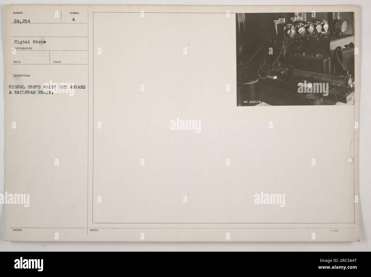 A Signal Corps radio set is seen aboard a railroad train numbered ...