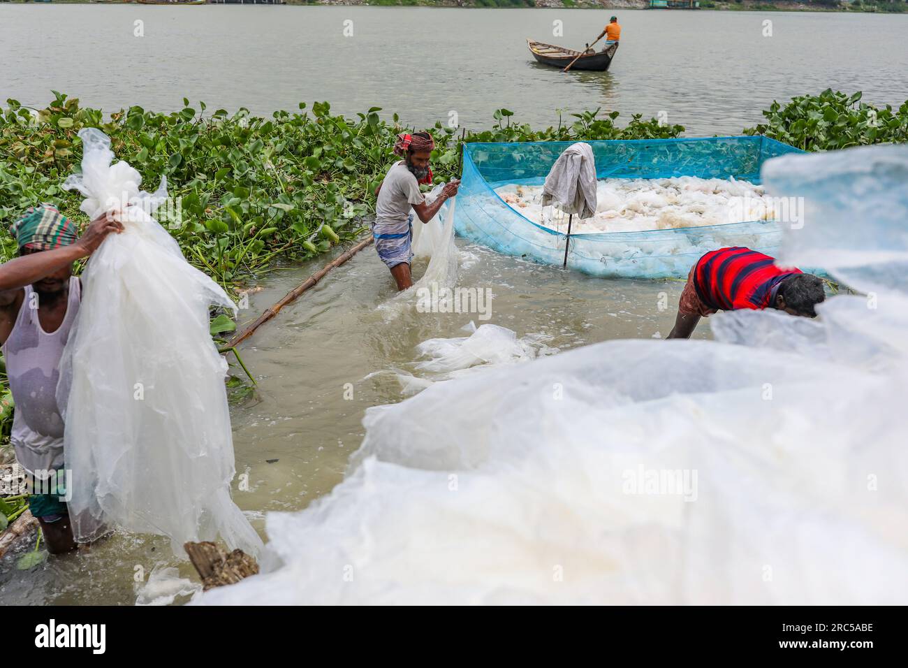 Dhaka, Bangladesh. 11th July, 2023. Workers are working in polythene ...