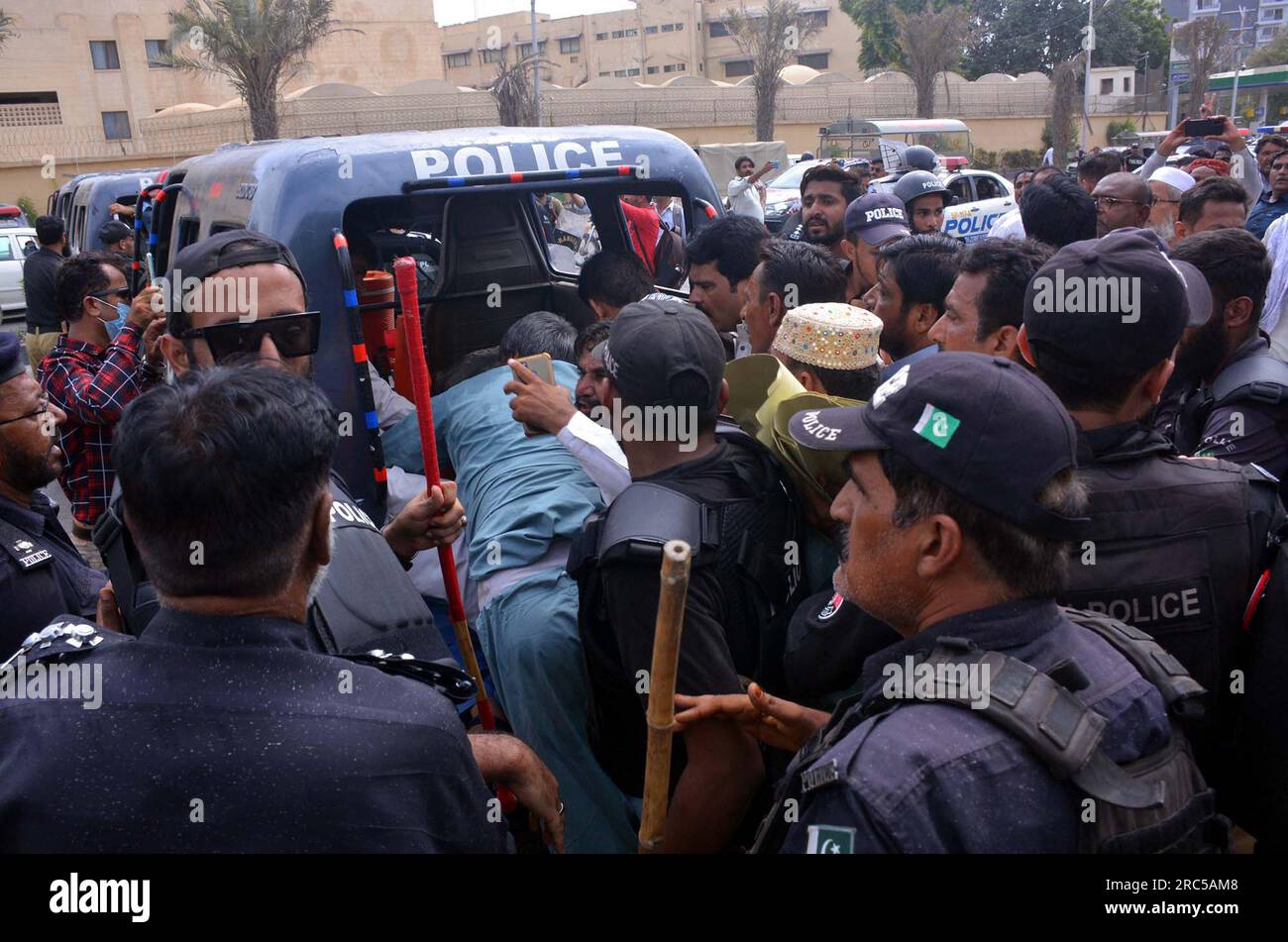 Hyderabad, Pakistan, July 12, 2023. Security officials restore baton ...