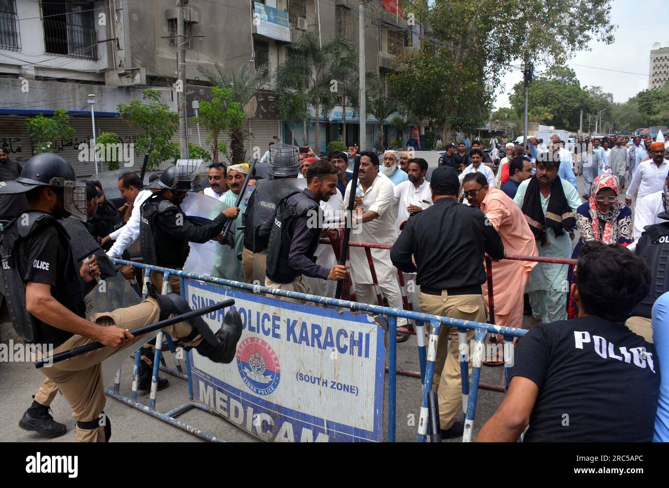 Hyderabad, Pakistan, July 12, 2023. Security officials restore baton ...