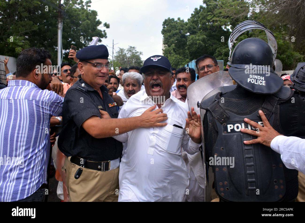 Hyderabad, Pakistan, July 12, 2023. Security officials restore baton ...