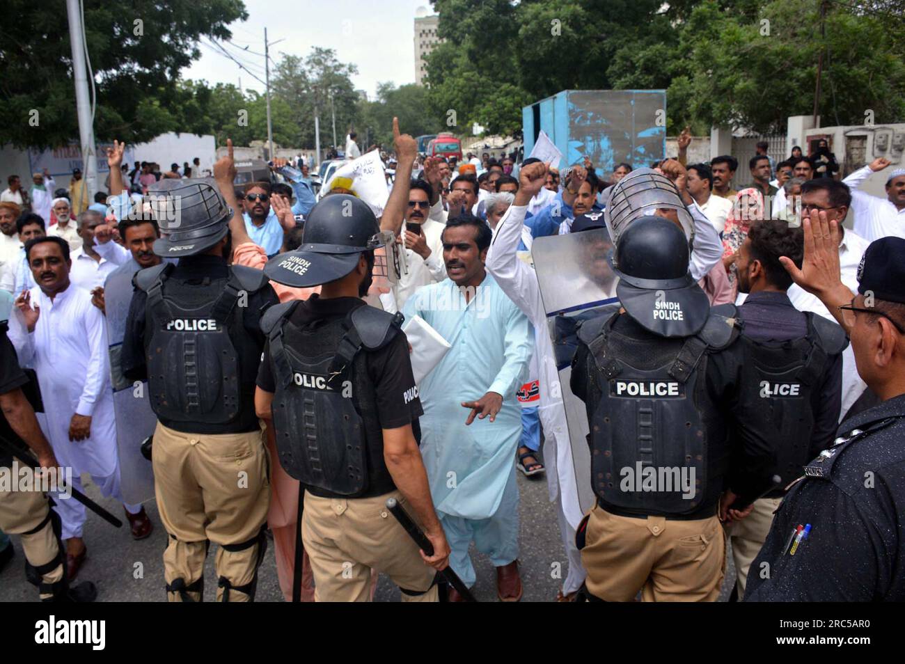 Hyderabad, Pakistan, July 12, 2023. Security officials restore baton ...