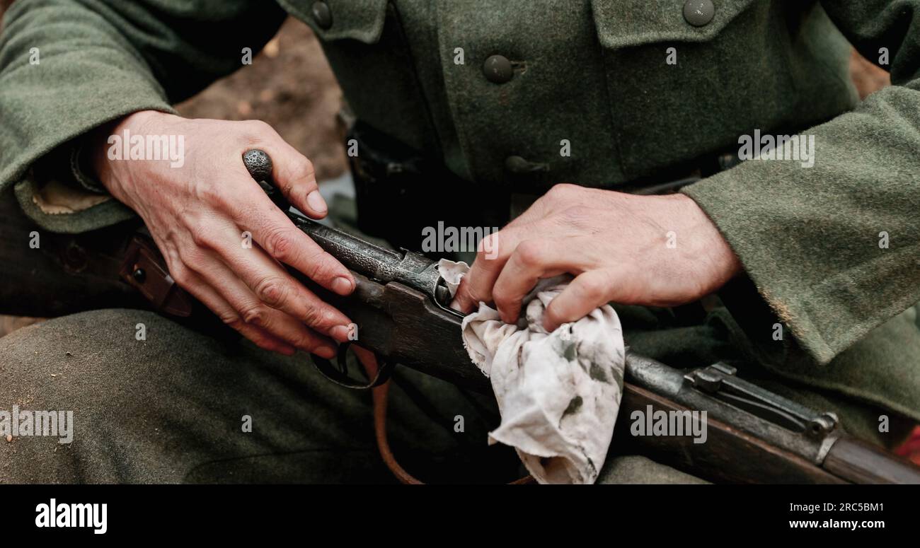 World War II German Soldier Cleaning Rifle. Soldier Preparing Weapon ...