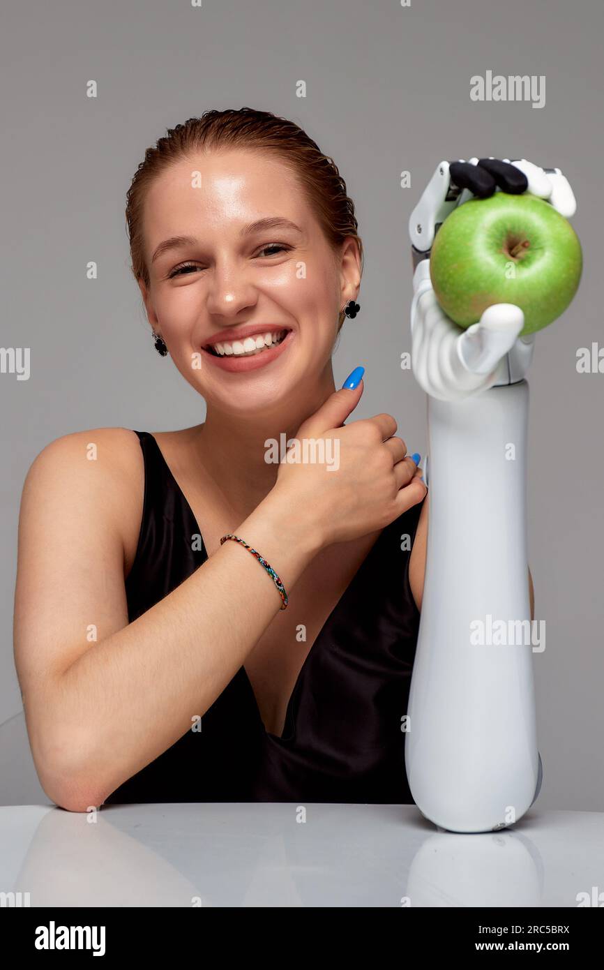 Young smiling girl with disability wearing sensory bionic prosthetic ...