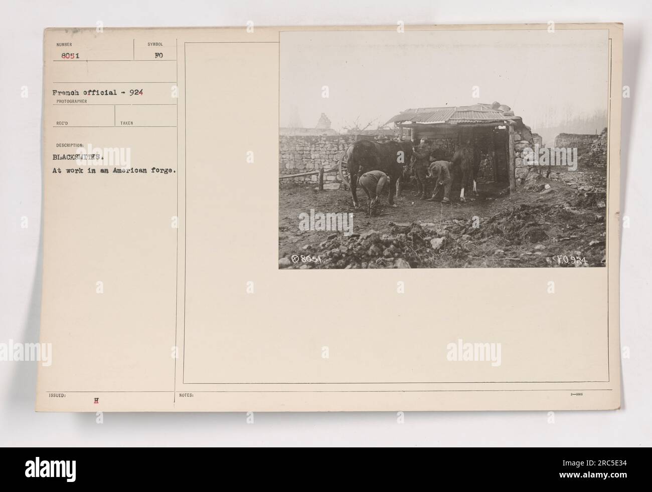 American blacksmiths working in a forge during World War One. Photo ...