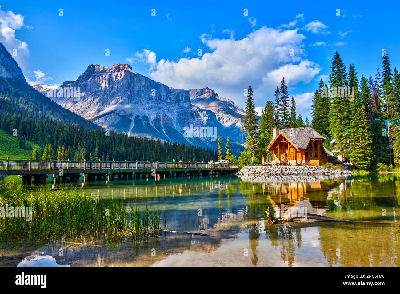 Bridge leading to wooden lodge on Emerald lake with beautiful ...