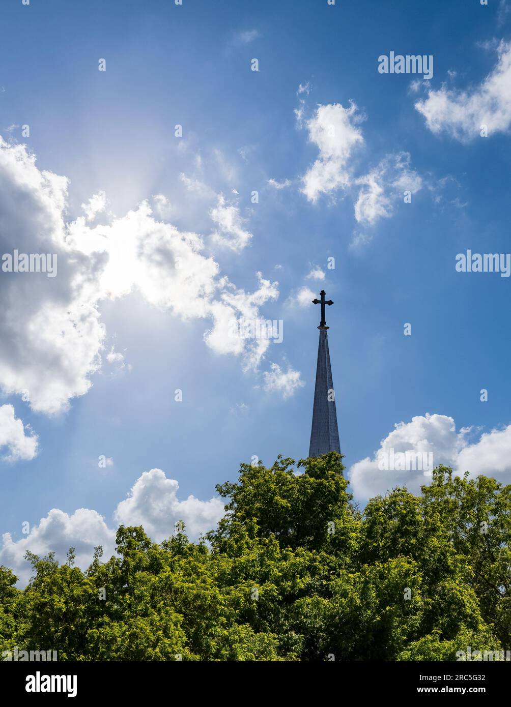 Tall church steeple with cross on top Stock Photo - Alamy