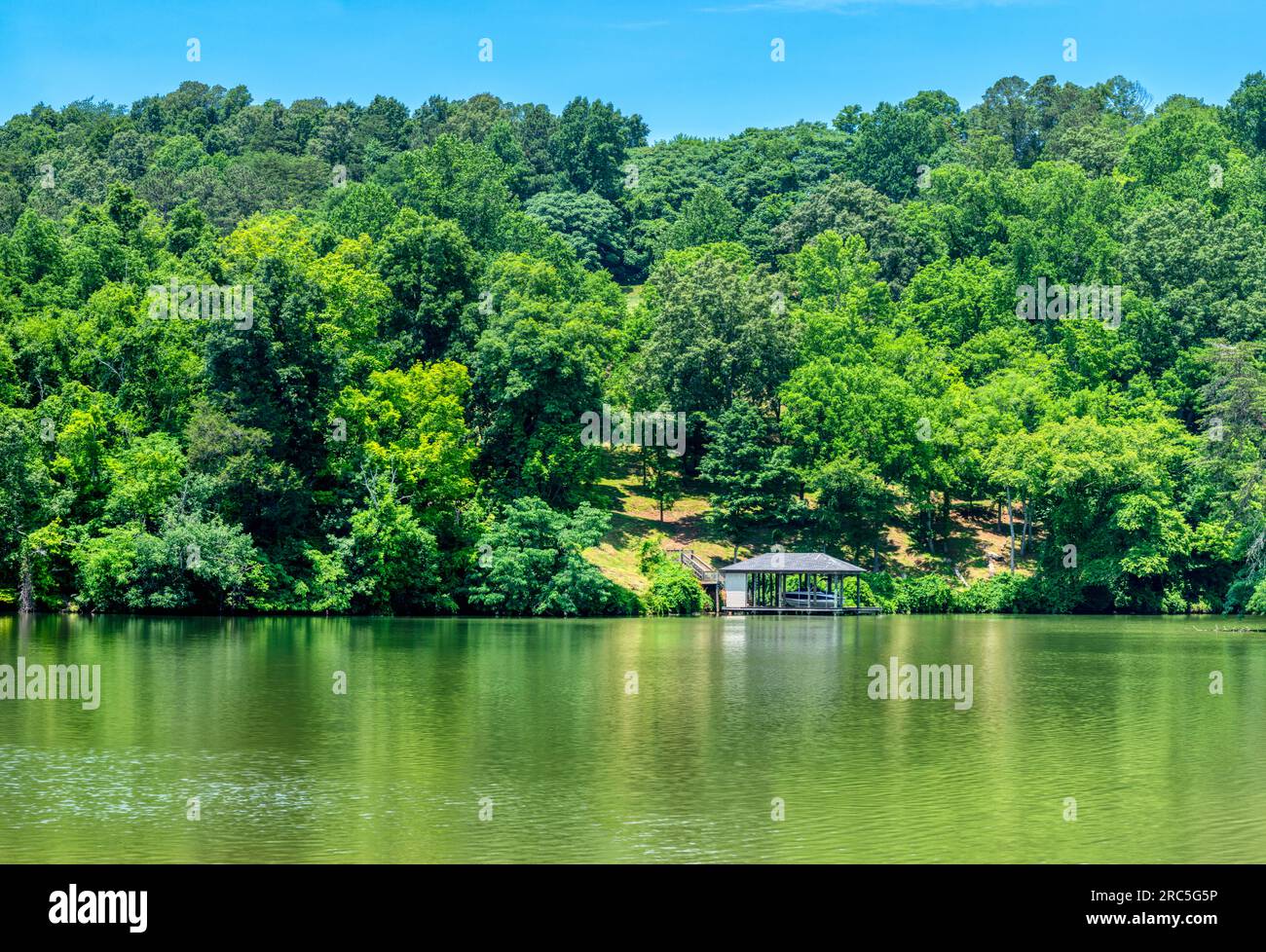 Horizontal river background image with boathouse Stock Photo - Alamy
