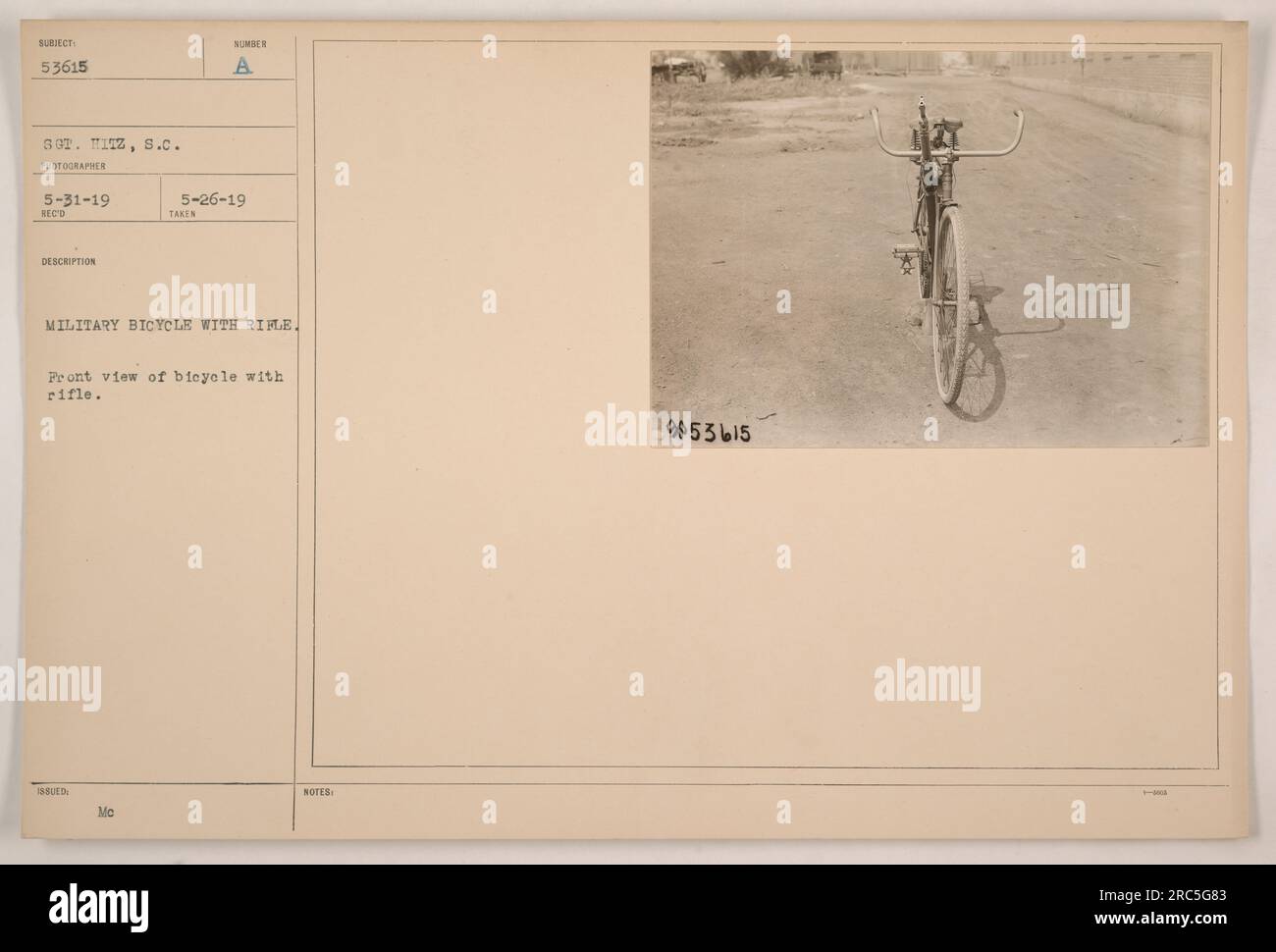 An image of a military bicycle equipped with a rifle attached to the ...