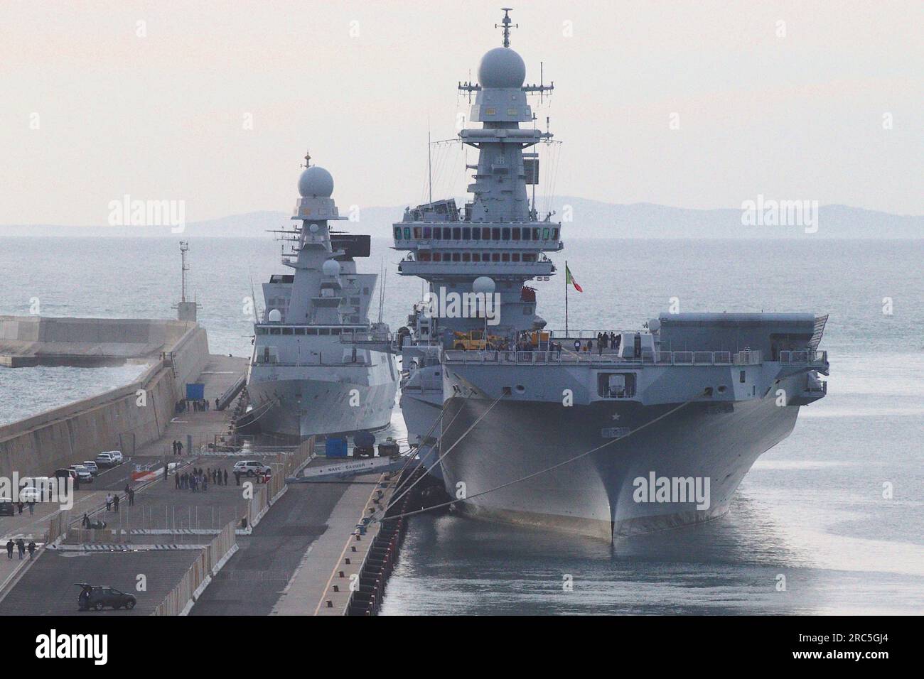 Italian aircraft carrier Cavour, supported by the Italian destroyer ...