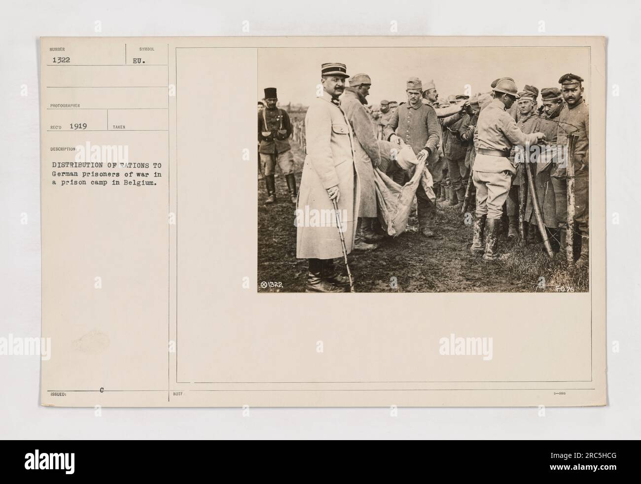 German prisoners of war being provided with rations inside a prison ...