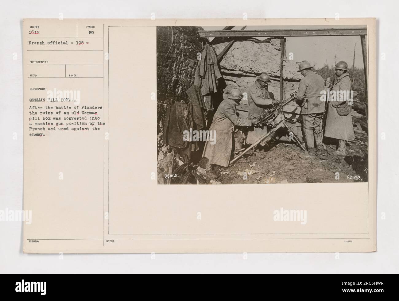 French soldiers converting a ruined German pillbox into a machine gun ...
