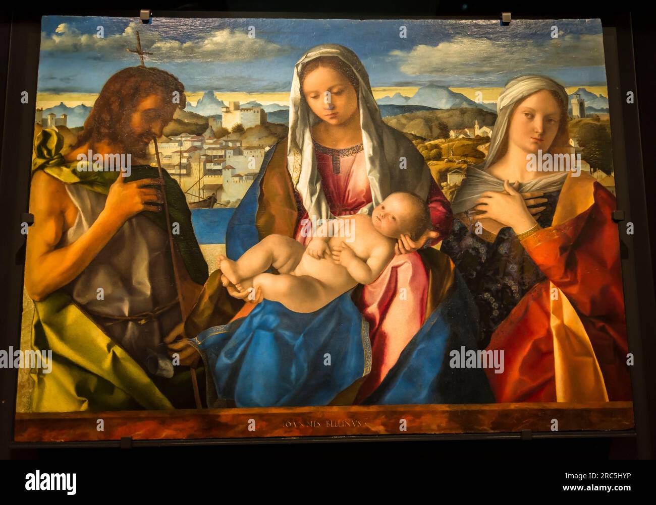 Giovanni Bellini painting Madonna with Child surrounded with two Saints ...