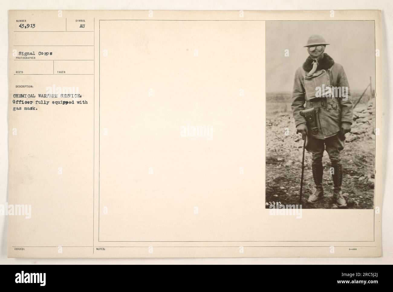 An officer from the Chemical Warfare Service fully equipped with a gas ...