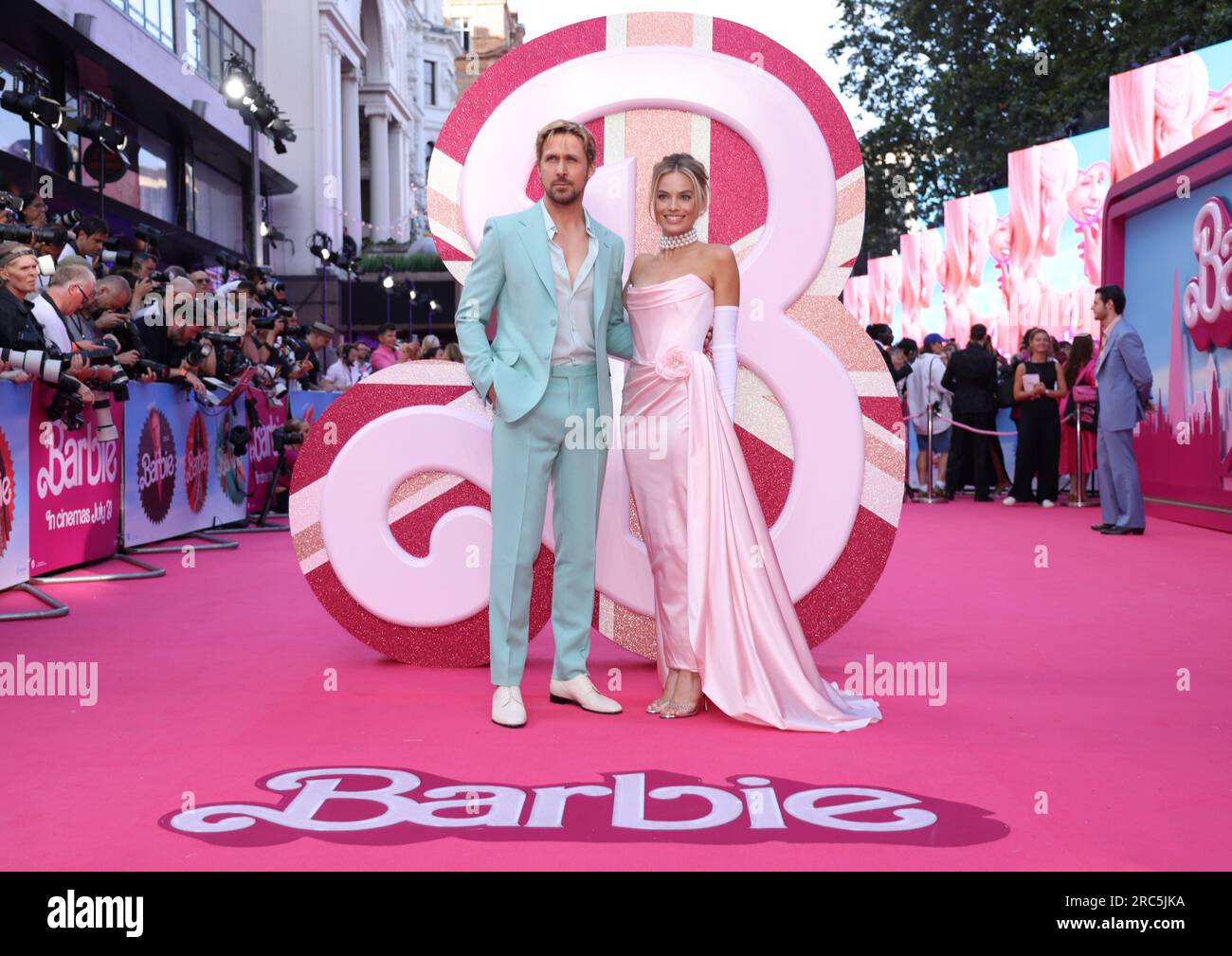 Ryan Gosling, left, and Margot Robbie pose for photographers upon ...
