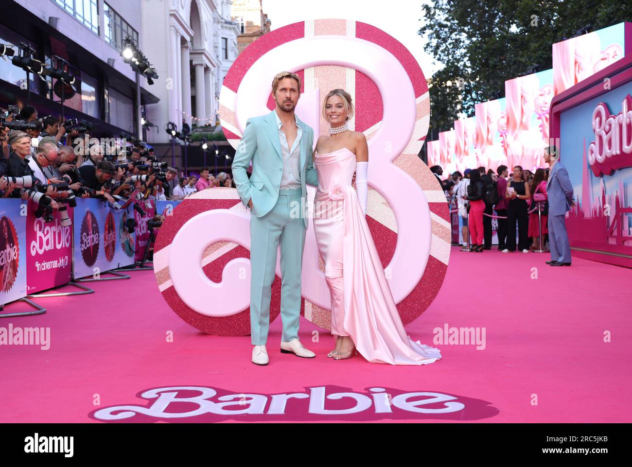 Ryan Gosling, left, and Margot Robbie pose for photographers upon ...