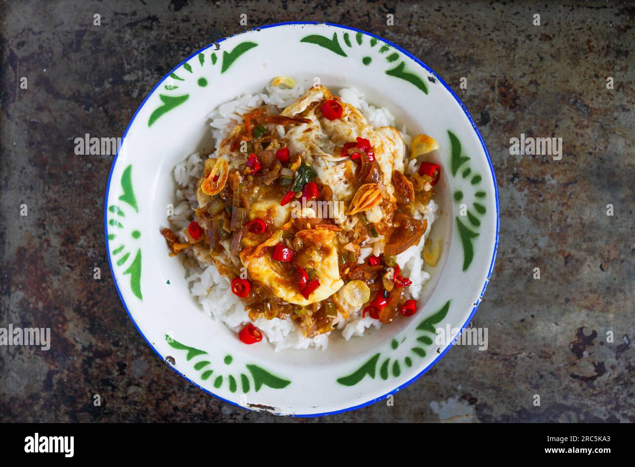 Nasi Telur Pontianak is White rice served with fried eggs cooked in ...