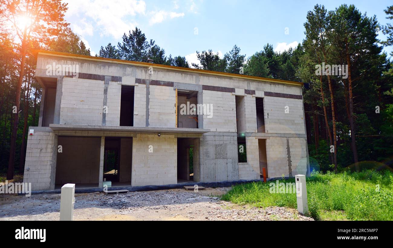 Single modern house under construction. A building on the edge of the ...