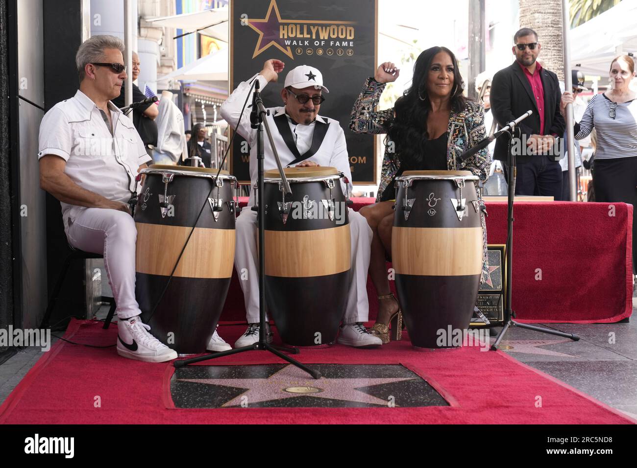 Sheila E. plays the precussion with her brothers, Juan Escobedo, center ...