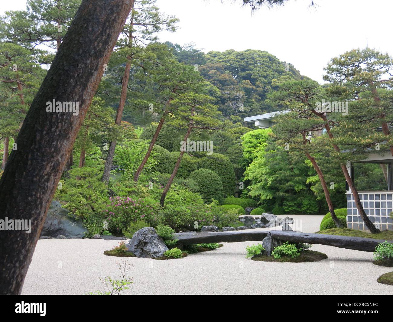View through the window of one of the gardens at Adachi Museum of Art ...