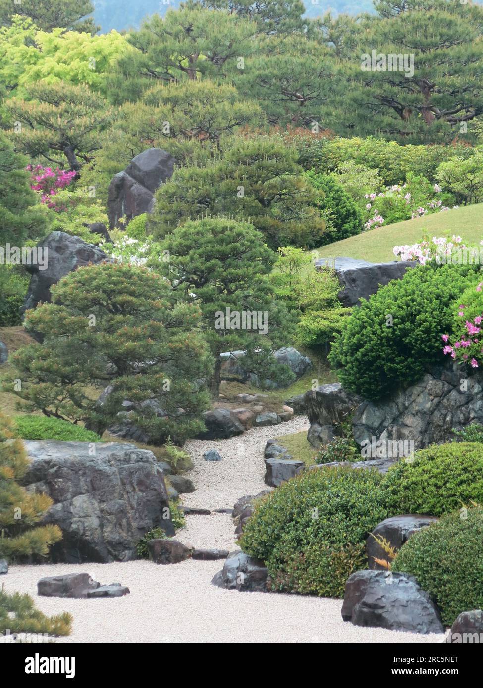 View through the window of one of the gardens at Adachi Museum of Art ...