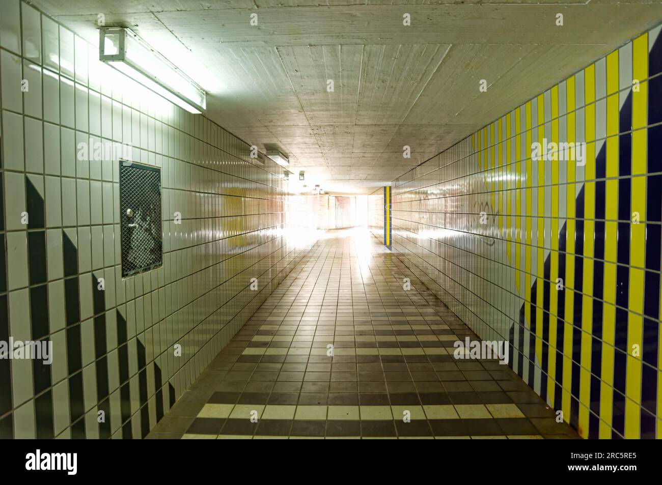 A wide-angle shot of the interior of an underground subway station ...