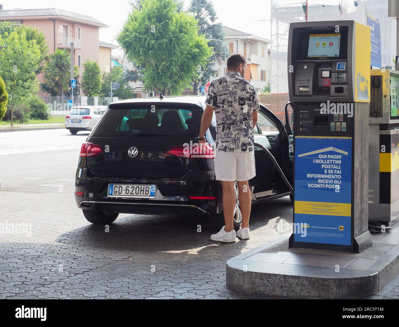 Cremona, Italy - July 3 2023 Customer self service refilling car at eni ...
